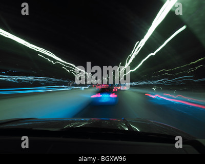 Blurred car lights in evening traffic Stock Photo - Alamy