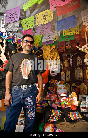 Artist Raymond Sandoval in his booth at the Contemporary Hispanic ...