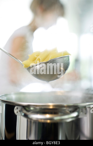 Stainless steel individual cooking pots Stock Photo - Alamy