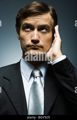 Man with hand cupped around ear listening attentively Stock Photo - Alamy