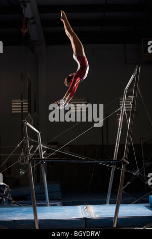 Young gymnast in mid-air leap Stock Photo - Alamy