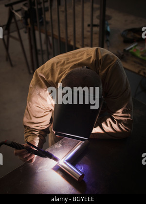 Steel worker in metal shop Stock Photo - Alamy