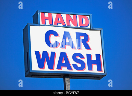 Sign advertising a hand car wash business Stock Photo - Alamy