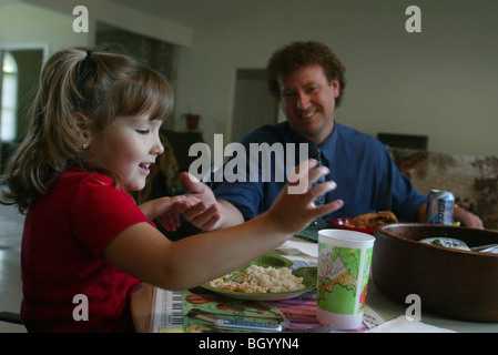 Cardiologist Greg Heumann spends time with his children Rachel, left ...