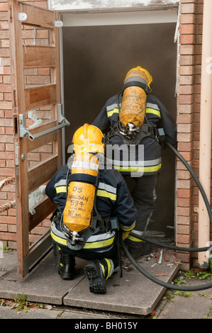 Firemen enter school classroom on fire Stock Photo - Alamy