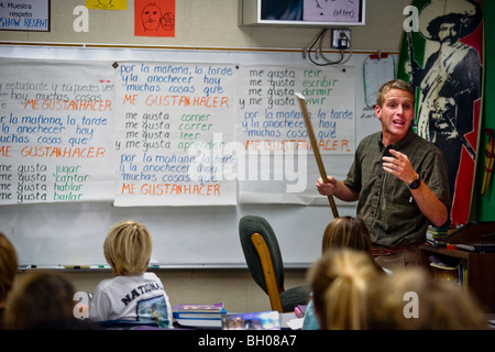 An enthusiastic middle school Spanish teacher conducts his Stock Photo ...