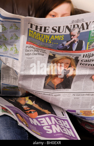 Teenager Reading Sunday Newspaper Stock Photo - Alamy