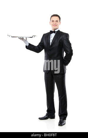 Waiter holding silver tray and towel Stock Photo - Alamy