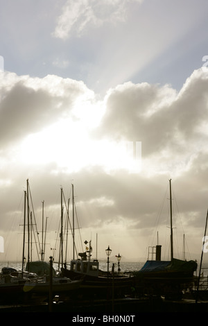 Sun rays breaking through clouds in blue sky over Punta Cana resort ...