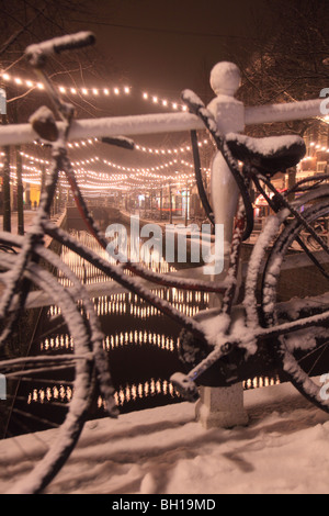 The Delft canal with bikes near the city center in the Netherlands ...