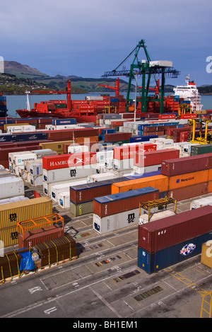 A cargo ship is orderly loading and unloading containers at the berth ...
