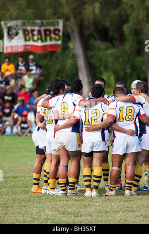 Fans at a rugby game on Rarotonga in The Cook Islands next to the sea ...