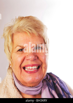 Smiling happy mature woman. Over pink background Stock Photo - Alamy