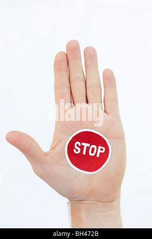 Red circular stop sign against urban scene Stock Photo - Alamy
