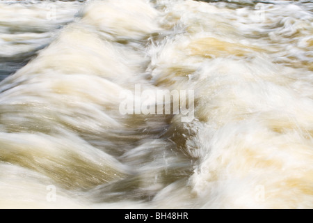 Rushing waters of the weir at Paper Mill Lock near Little Baddow Stock ...