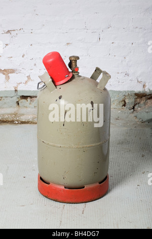Red color propane gas cylinder outdoor Stock Photo - Alamy