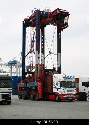 Gantry crane, straddle carrier, container. Shipping terminal wharf or ...