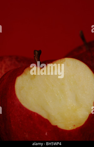 Red apple with bite taken Stock Photo - Alamy