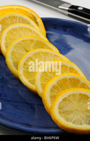 Lemon with lemon slices Stock Photo - Alamy