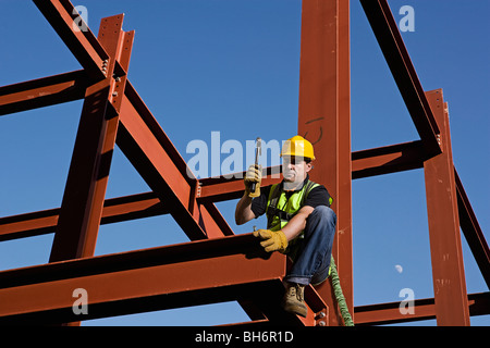 Construction worker on steel beam at construction site Stock Photo - Alamy