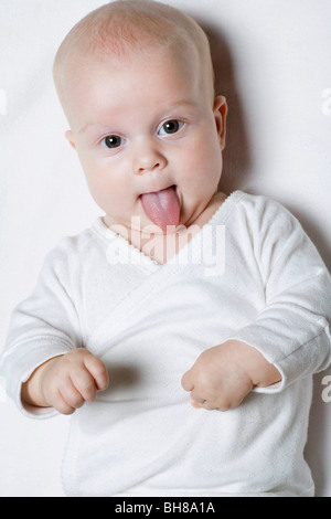 Baby sticking tongue out, portrait Stock Photo - Alamy