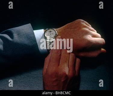 man hand with watch on wrist sun rays through palm. copy space Stock ...