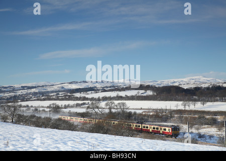 Train in winter snow, Scotland, UK Stock Photo - Alamy