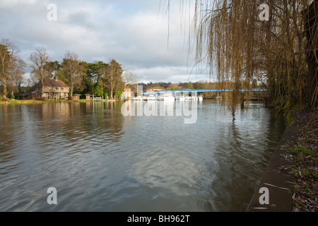 Foot bridge over river and moored boats, Horto village, South Pelion ...