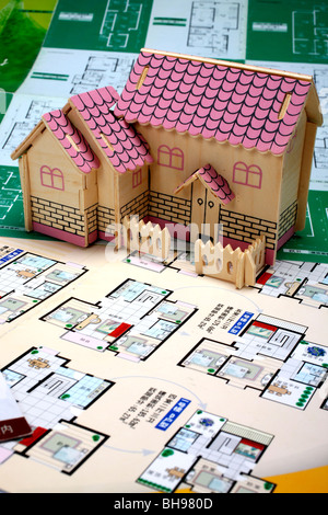 High angle view of house models on financial chart at office desk Stock ...