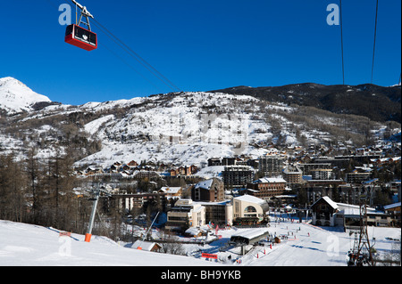 View over centre of Chantemerle from the slopes with gondola lift to ...