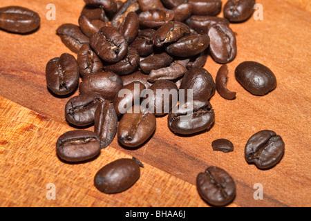 dark roast coffee bean on wooden board Stock Photo - Alamy
