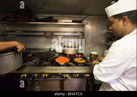 Indian chef cooking in a restaurant kitchen Stock Photo: 27897809 - Alamy