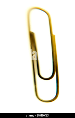 Twisted paperclip and paper Stock Photo - Alamy