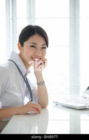 Japan, Osaka Prefecture, Businesswoman smiling, portrait Stock Photo ...