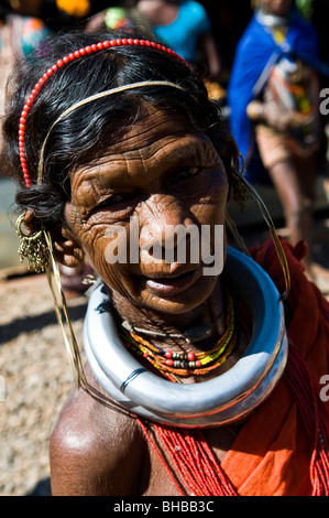 A Gadaba woman wearing traditional neck rings and earrings Stock Photo ...