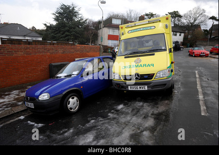 An ambulance crashed into a car after losing control on thick ice ...