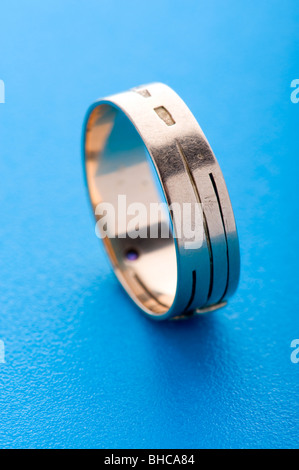object on blue - Gold rings close up Stock Photo - Alamy