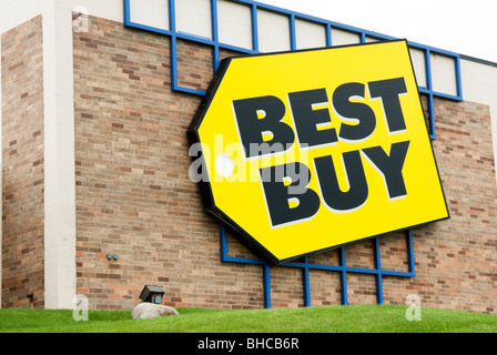 Exterior of Best Buy retail store with sign and logo and cars in ...