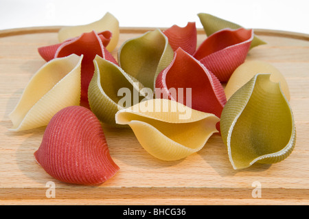 Large dried coloured pasta shells against a white background Stock ...