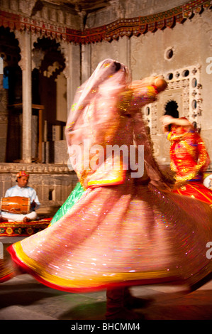 A Rajasthani woman performing traditional DANCE carrying nine water ...