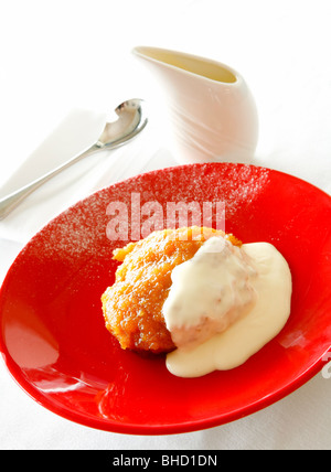 Treacle pudding with custard Stock Photo - Alamy