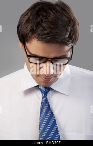 Asian business man looking down the plant seed grow on the desert Stock ...