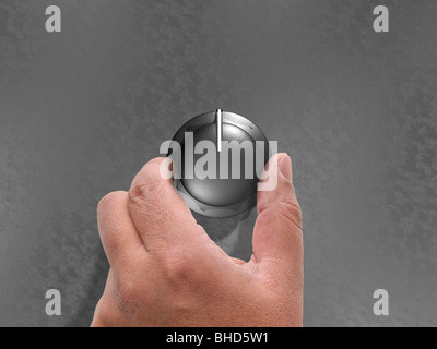 Man turning dial Stock Photo - Alamy