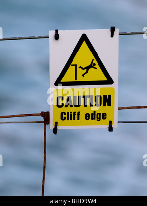 Caution cliff fall sign Stock Photo - Alamy