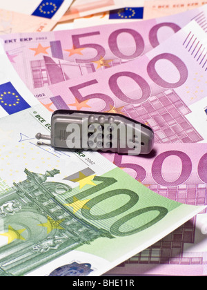 A toy mobile phone and Euro banknotes Stock Photo - Alamy