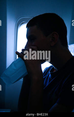 person with airsickness in a plane Stock Photo - Alamy