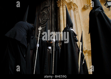 Penitent in traditional hood and robe in an Easter parade on Holy ...