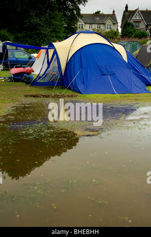 Tents on flooded campsite in the Lake District, in summer after heavy ...
