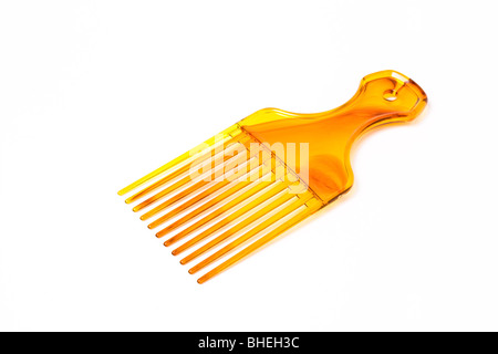 Wide plastic afro comb from low viewpoint isolated against white ...