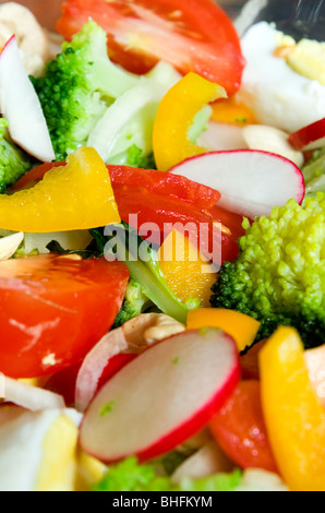 Fresh vegetable salad ingredients, shot from above on a white ...